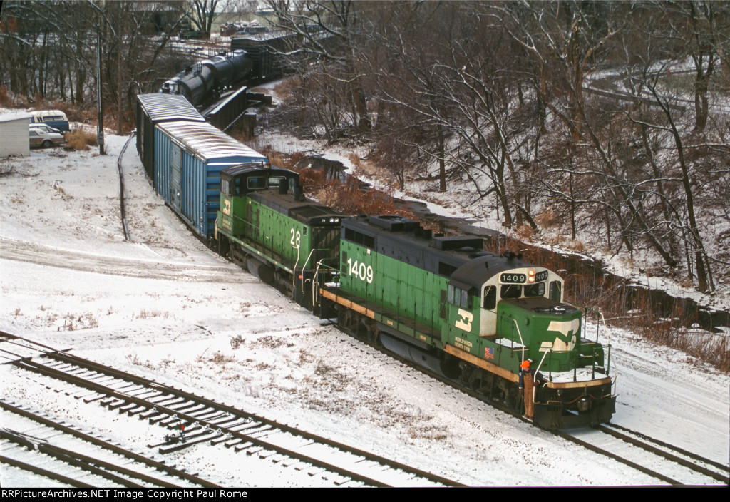 BN 1409, EMD GP7 rebuild, now GP10, leading SW1500 BN 28 past Hill Yard